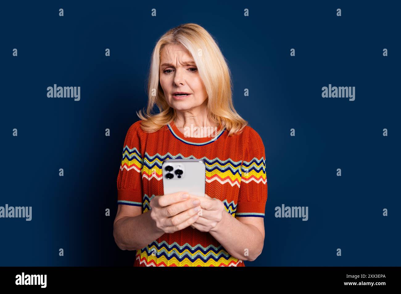 Photo of worried nervous lovely senior woman wear striped stylish ...