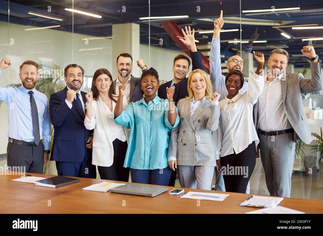 Corporate portrait of overjoyed diverse office employees workers show ...