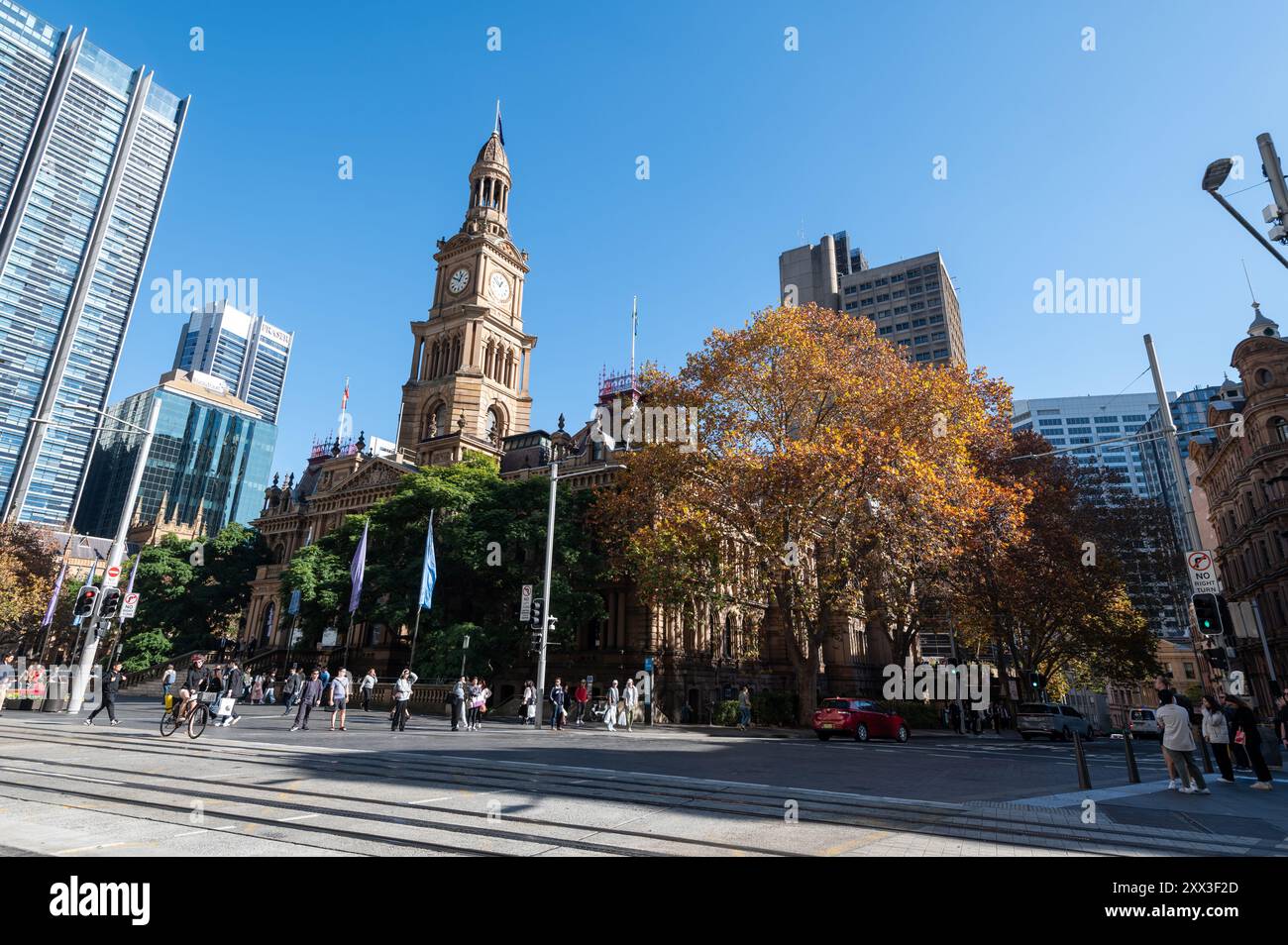 An autumn scene of Sydney Town Hall with lock tower on Town Hall Square ...