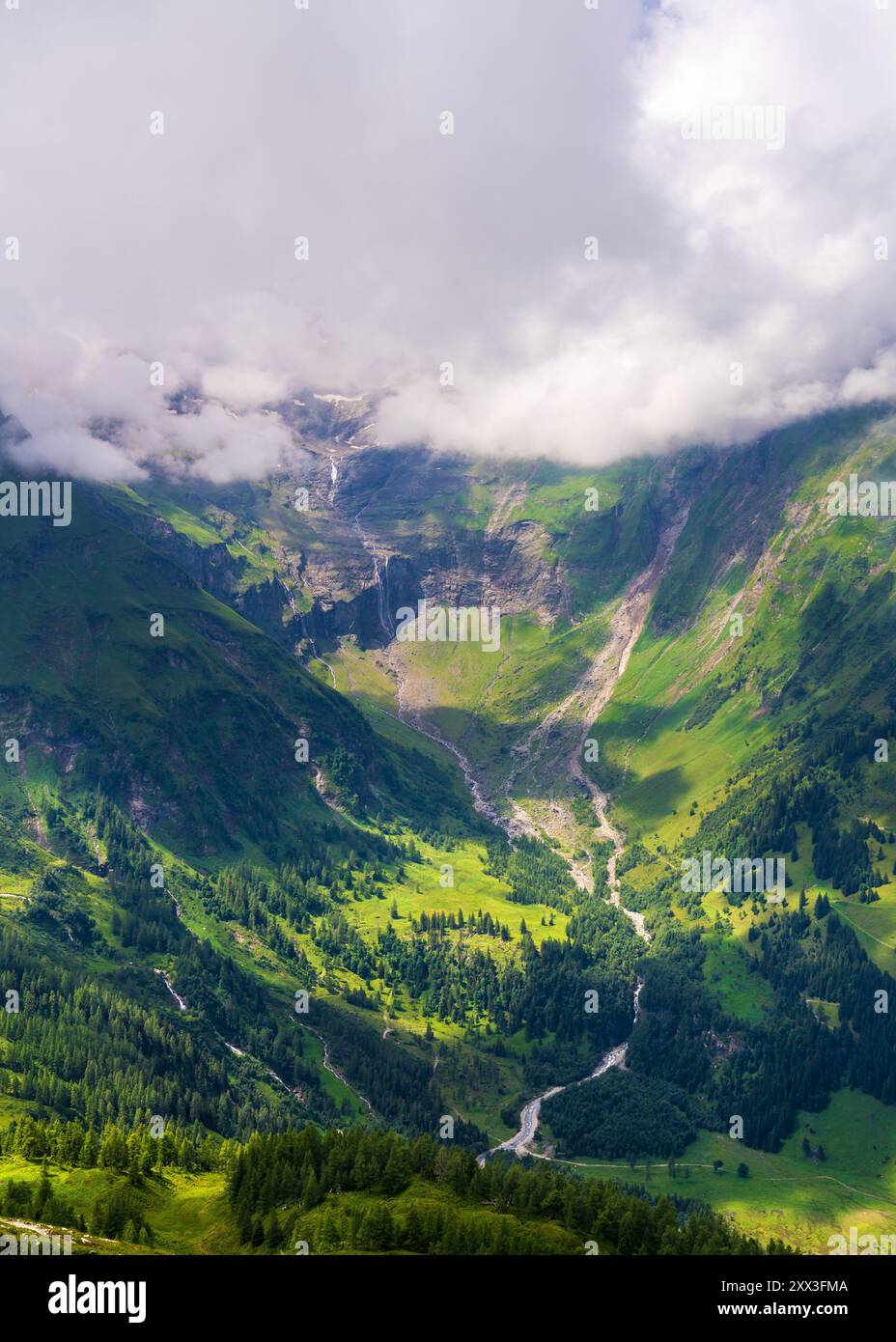 Majestic mountain peaks covered with clouds. Mountain rivers ...