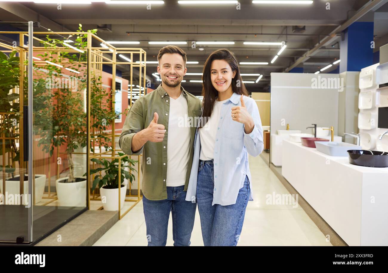 Happy Married Couple Giving Thumbs Up in Plumbing Store Stock Photo - Alamy