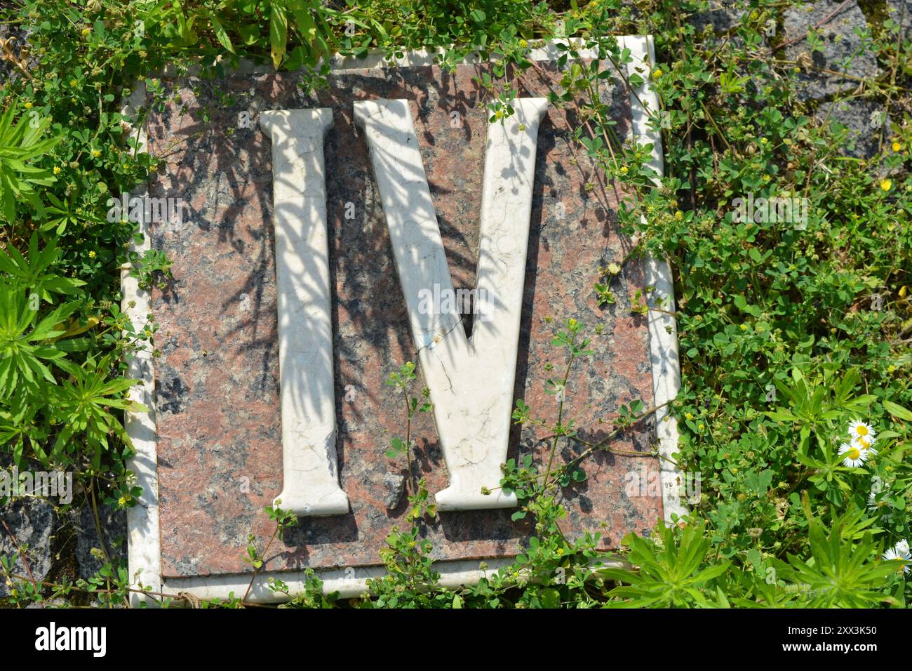 Building materials, memorials, white inscriptions in gray, brown ...