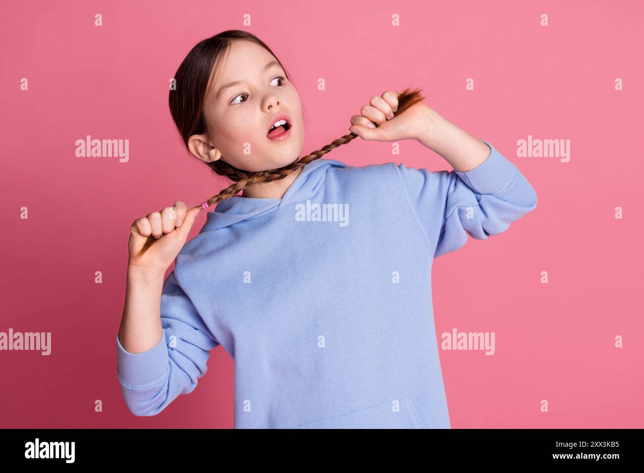 Photo of lovely small schoolkid choke braids wear hoodie isolated on ...