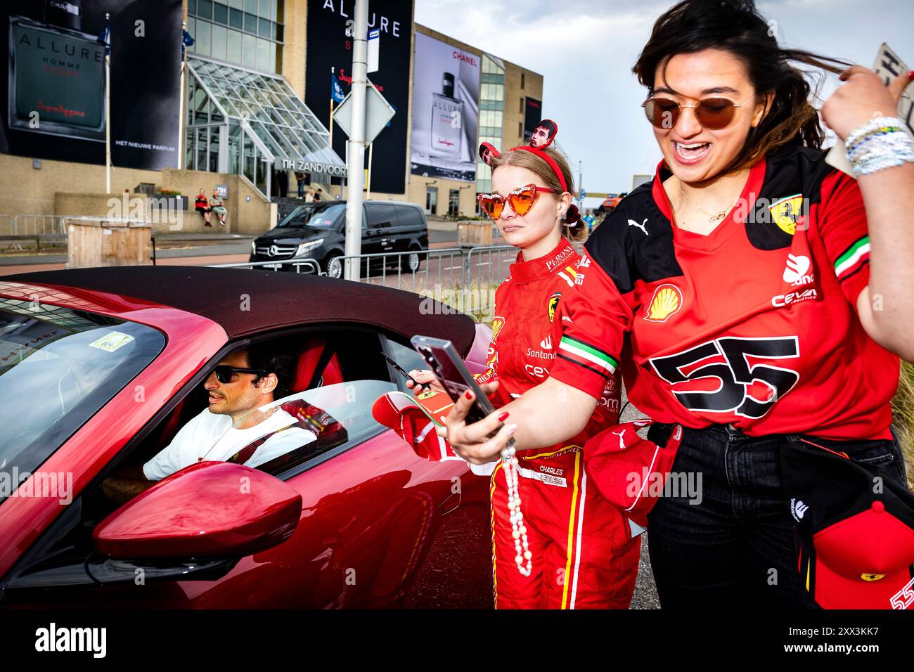 ZANDVOORT - Ferrari fans take a selfie with Carlos Sainz arriving at ...