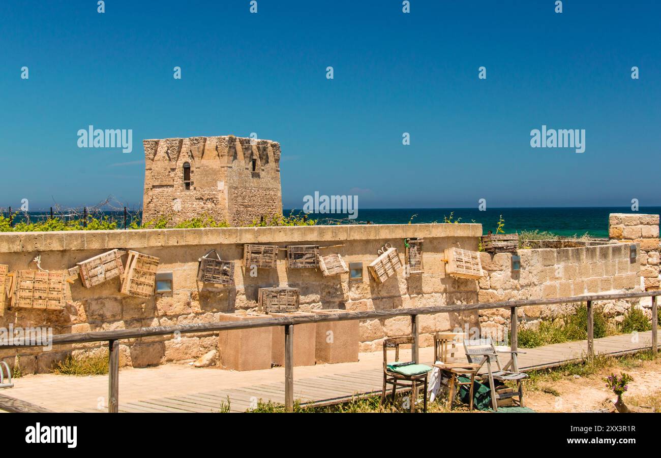 View of an ancient watchtower in southern Italy built near the sea ...