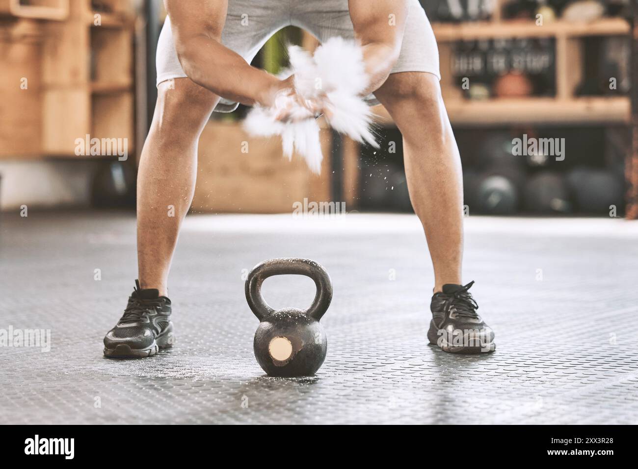 Fitness, kettlebell exercise and dust at gym for weight training ...