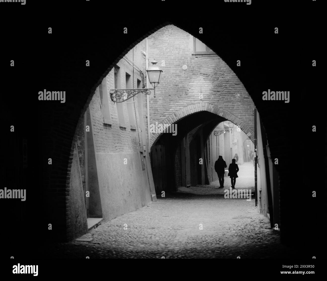 Women walking under arch Black and White Stock Photos & Images - Alamy