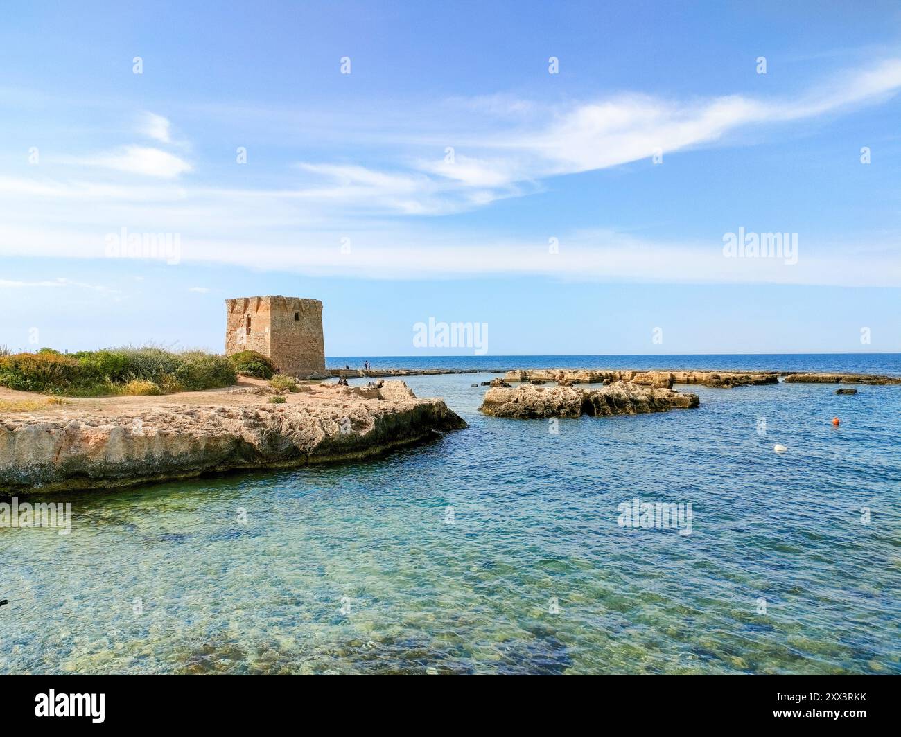 View of an ancient watchtower in southern Italy built near the sea ...