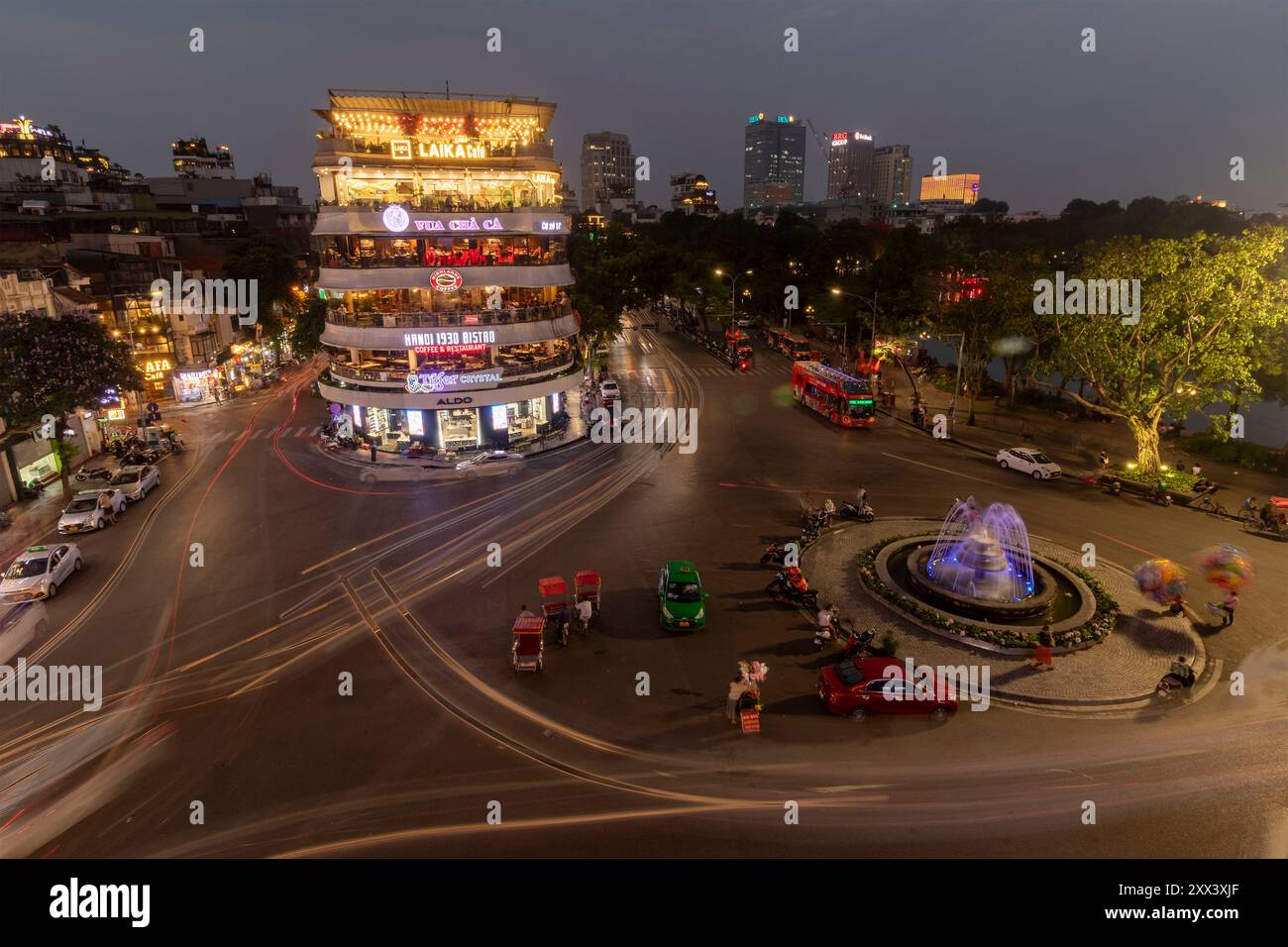 Spectacular high angle sunset / night image of Hanoi's Old Town main roundabout and fountain ...
