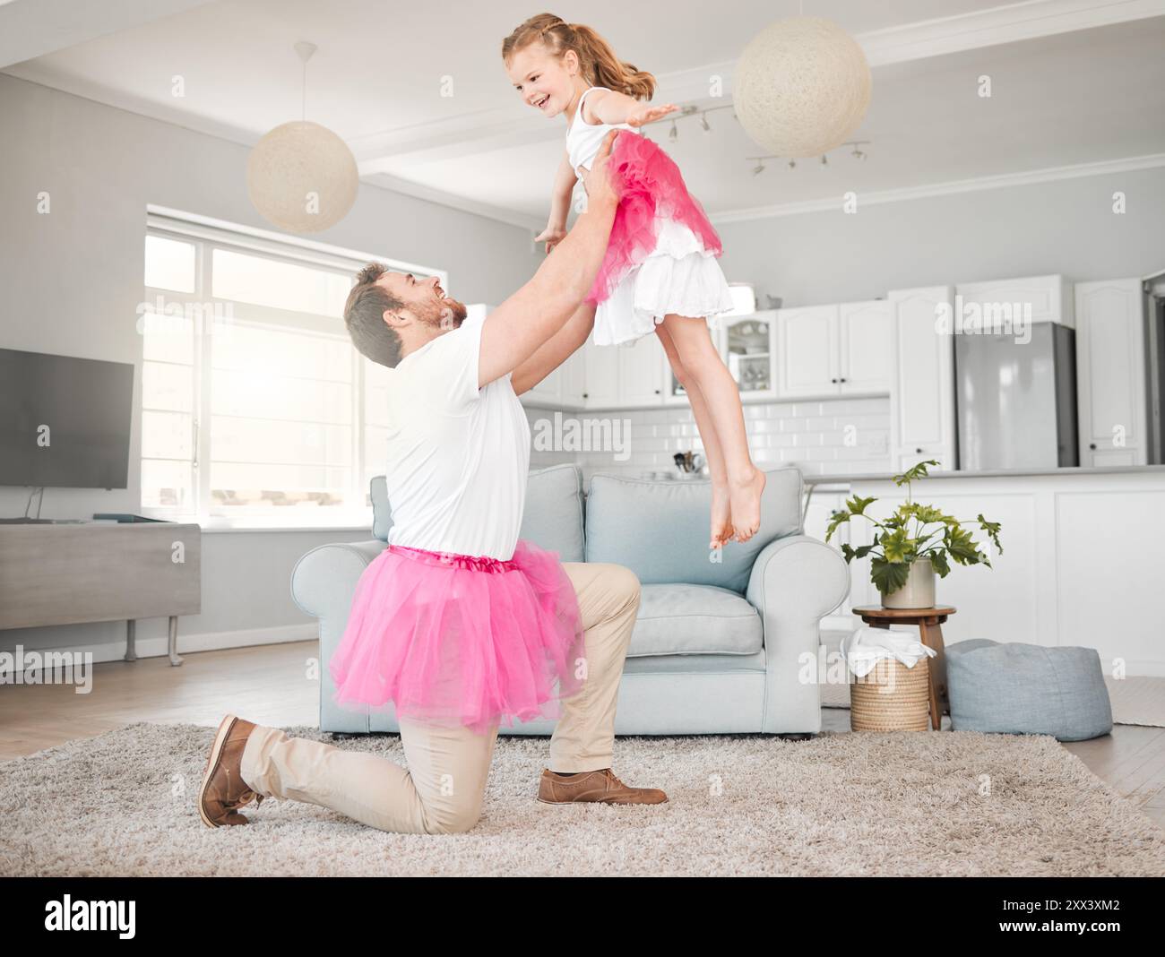 Father, child and ballet dancing in home with lifting, favorite song ...