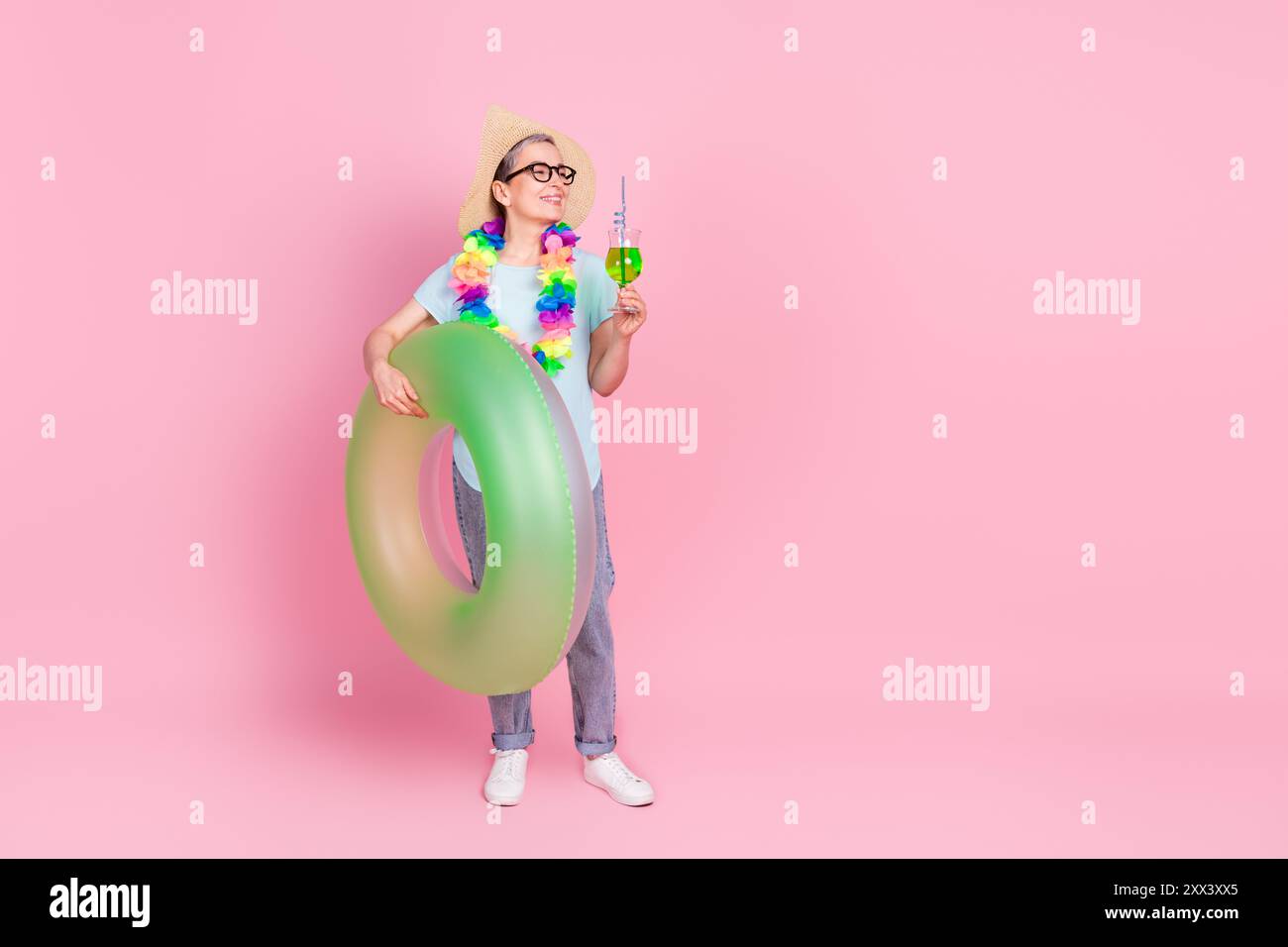 Full body portrait of nice aged lady inflatable ring cocktail look ...