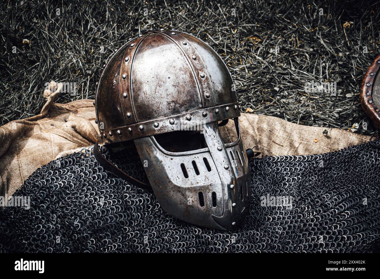 Medieval helmet and chainmail armour on the ground at the Battle Of ...