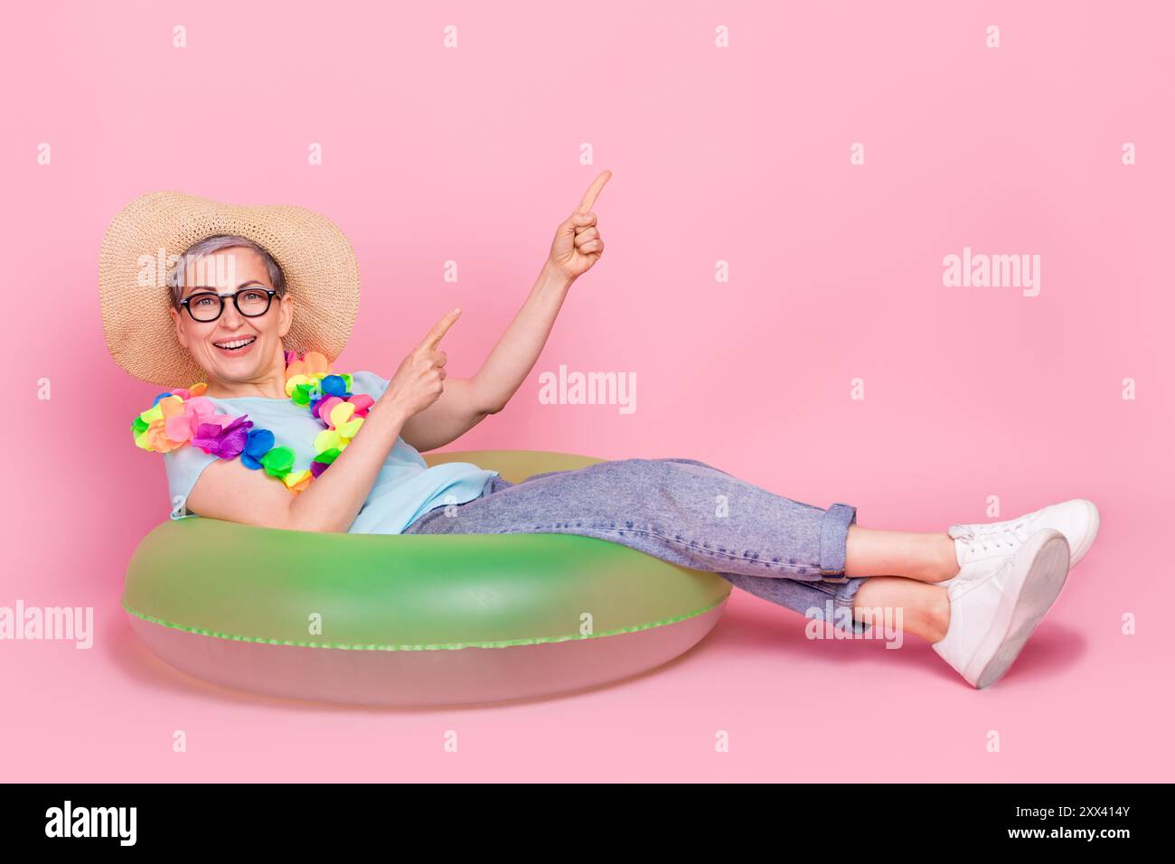 Full body portrait of nice aged lady inflatable ring direct fingers ...