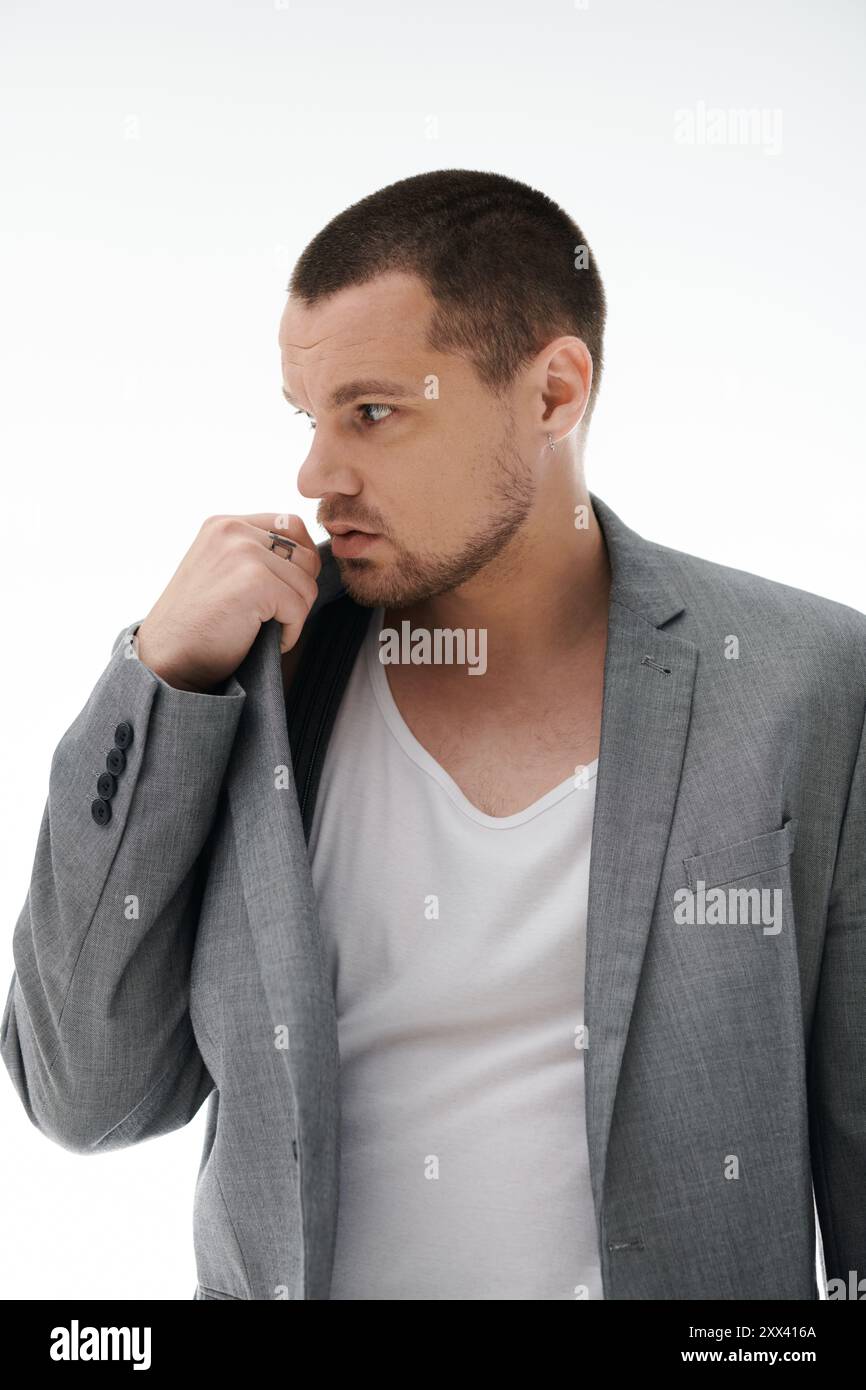 Confident groom adjusting jacket hi-res stock photography and images ...