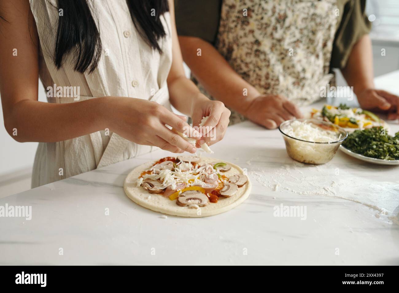 Girl Cooking Pizza With Her Grandma Stock Photo - Alamy