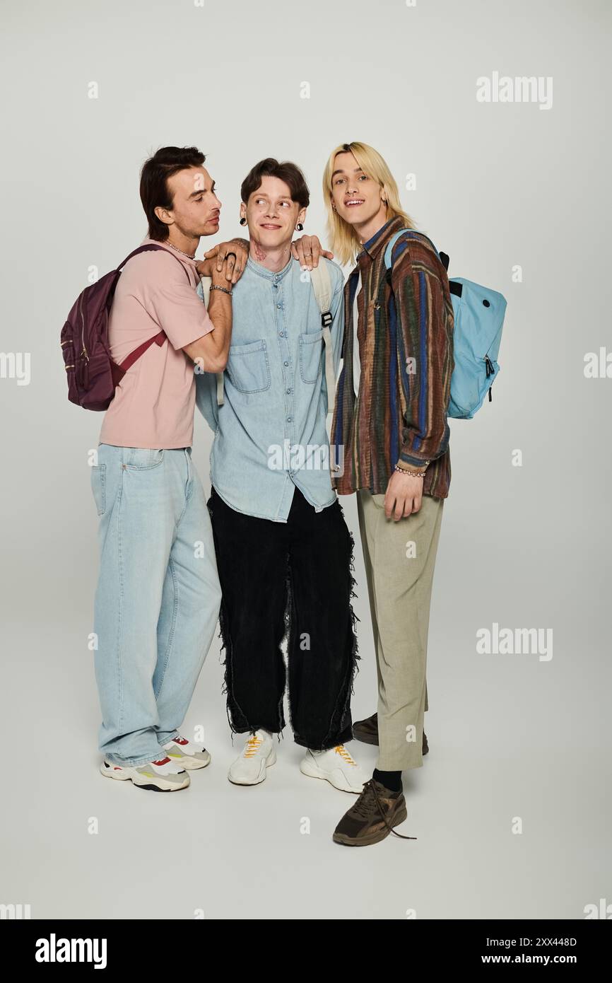 Three young people, members of the LGBTQIA community, stand together in ...