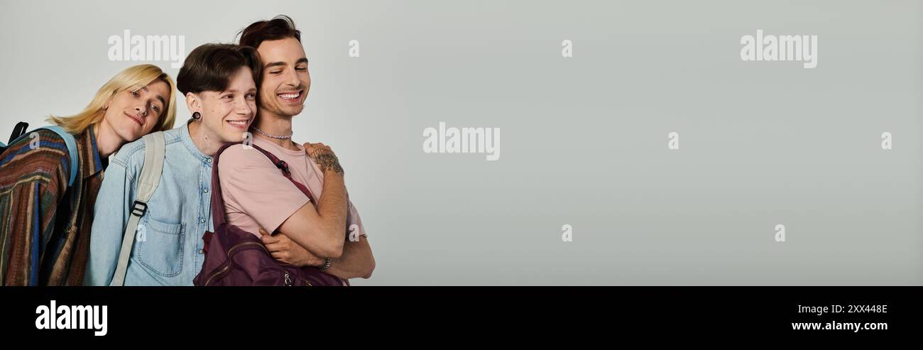 Three young people, members of the LGBTQIA community, stand together in ...