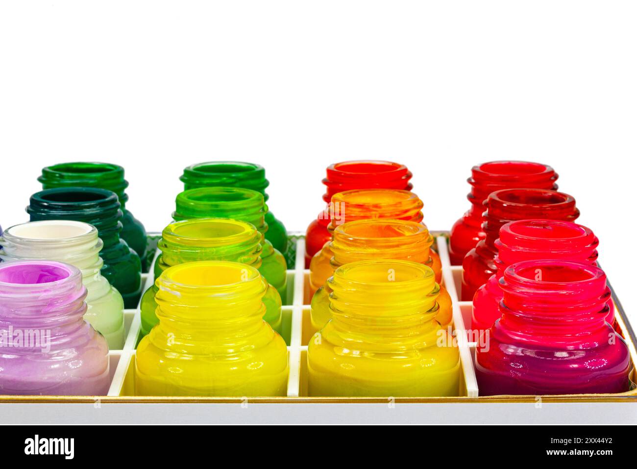 A vibrant display of various colored ink bottles arranged in a grid ...