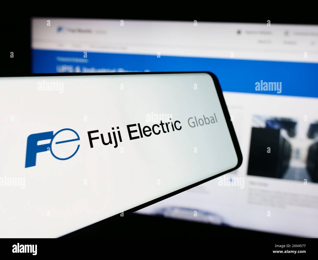 Mobile phone with logo of Japanese company Fuji Electric Co. Ltd. in ...