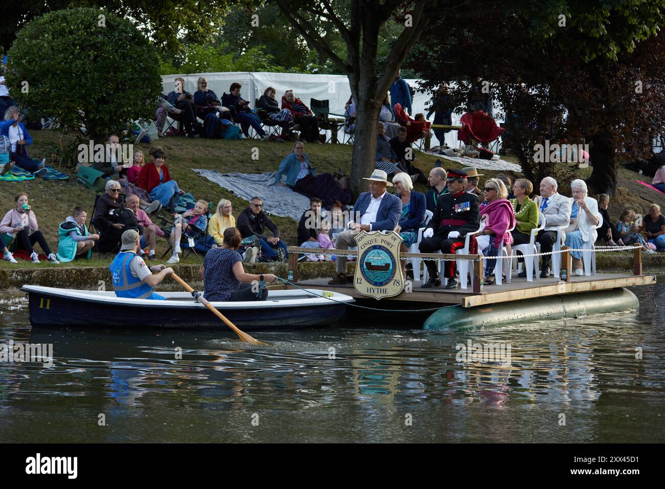 A procession of decorated boats and barges form a floating parade along ...