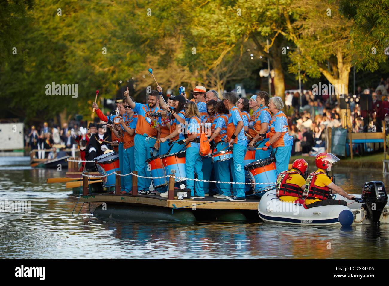 A procession of decorated boats and barges form a floating parade along ...