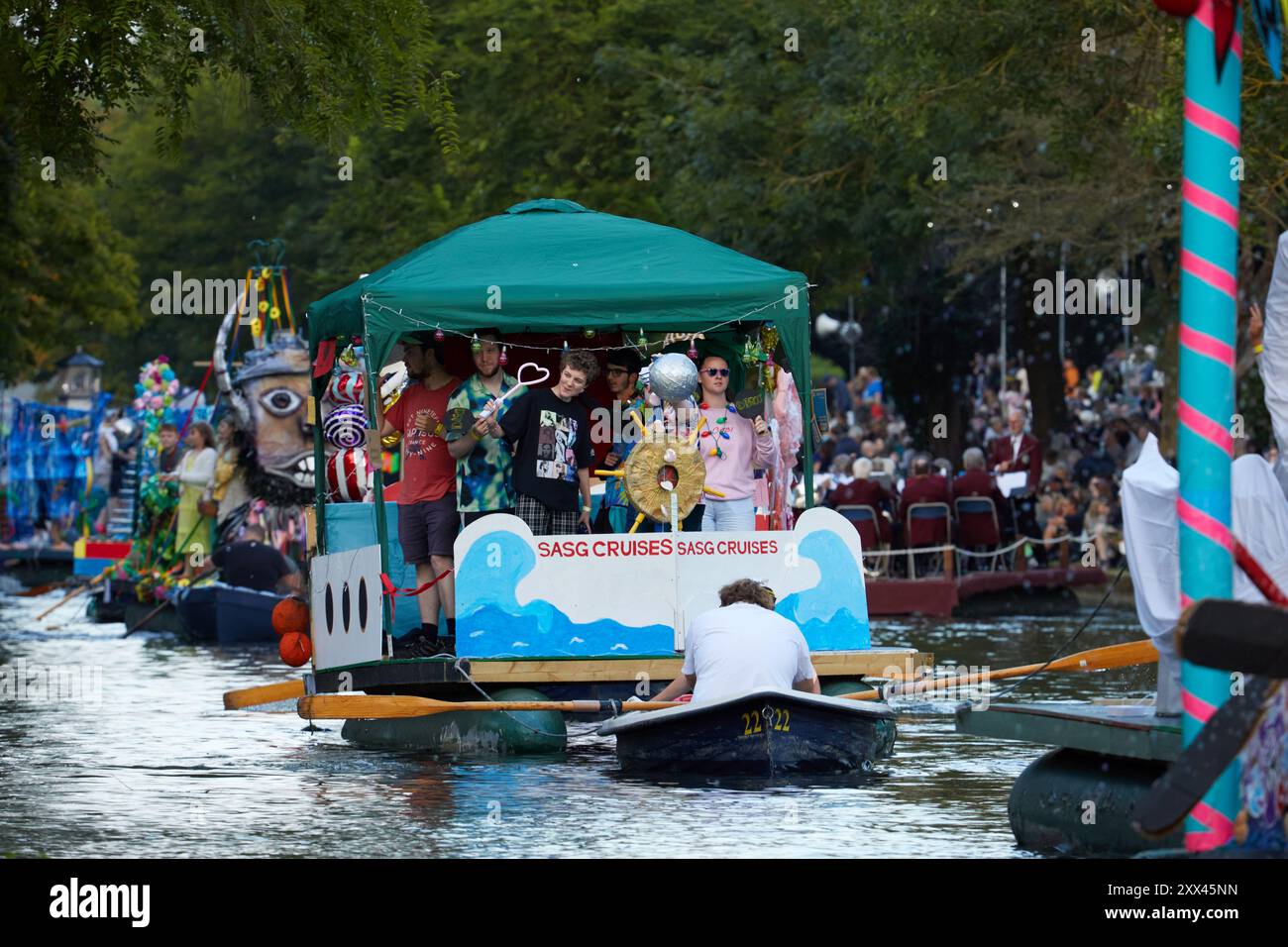 A procession of decorated boats and barges form a floating parade along ...
