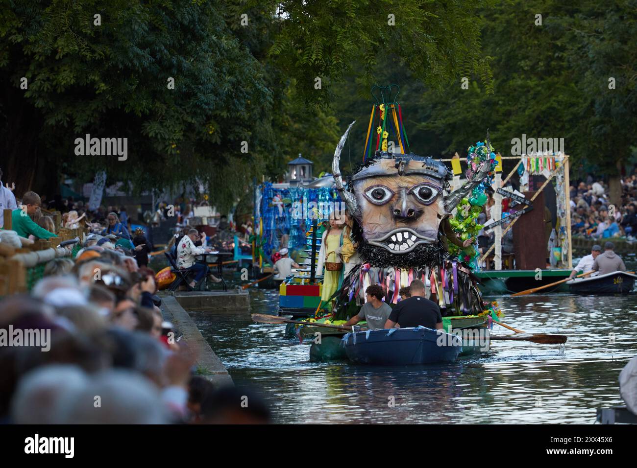 A procession of decorated boats and barges form a floating parade along ...