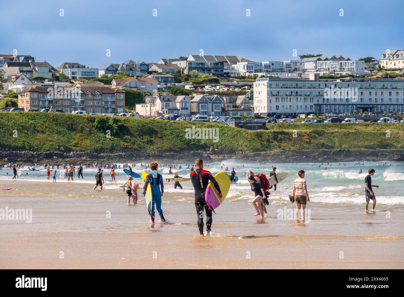 Surfers and holidaymakers enjoying the hot weather at Fistral Beach in ...