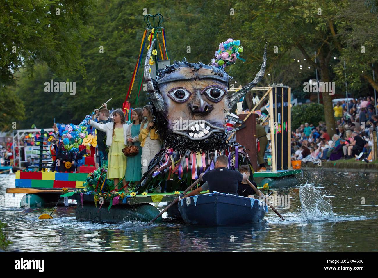 A procession of decorated boats and barges form a floating parade along ...