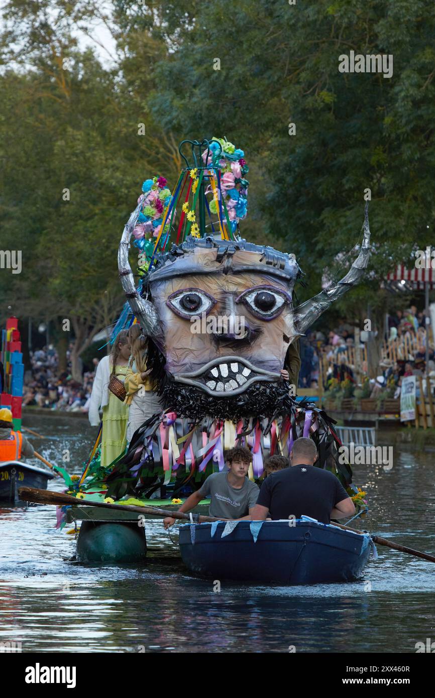 A procession of decorated boats and barges form a floating parade along ...