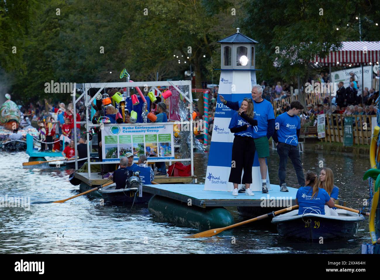 A procession of decorated boats and barges form a floating parade along ...