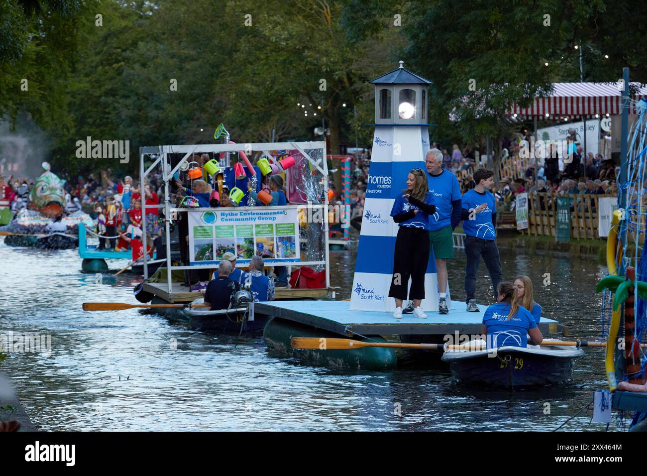 A procession of decorated boats and barges form a floating parade along ...
