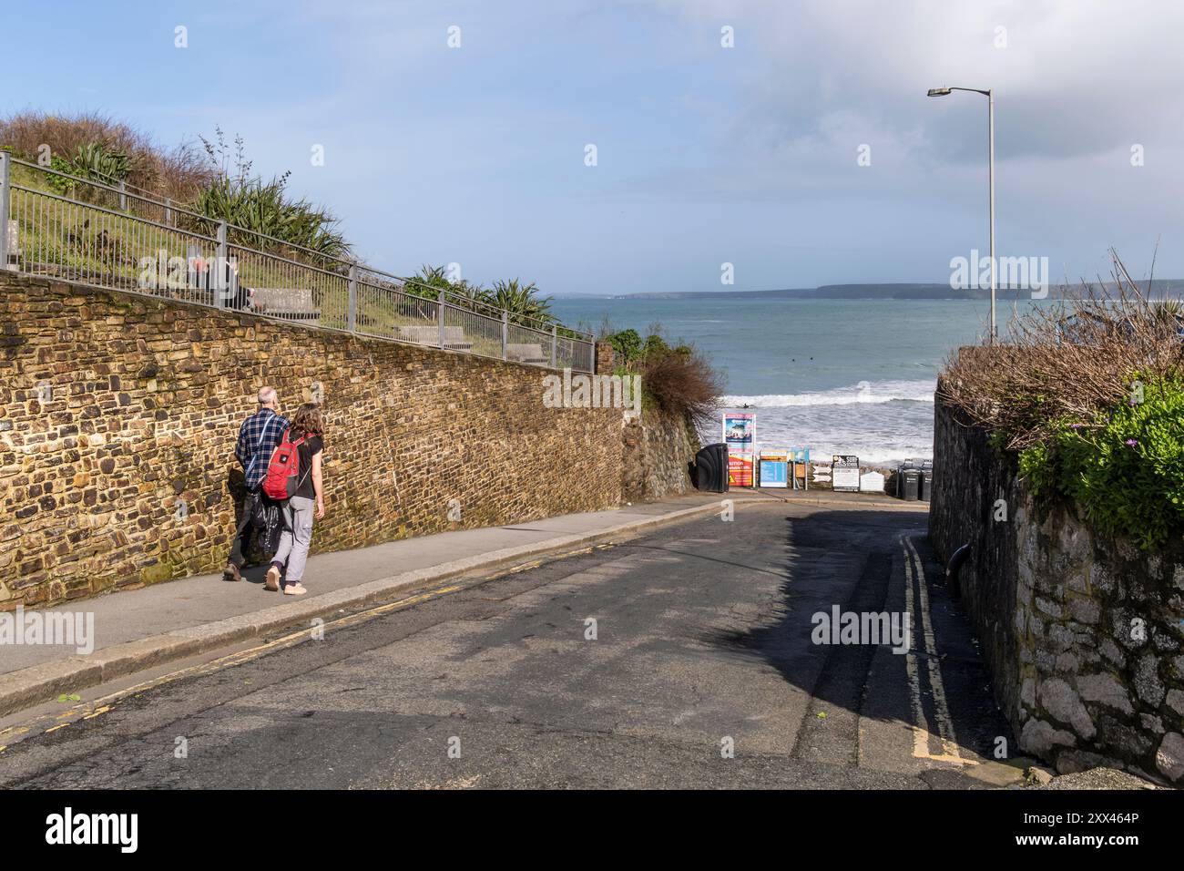 People walking down Beach Road that leads to Towan Beach in Newquay in ...
