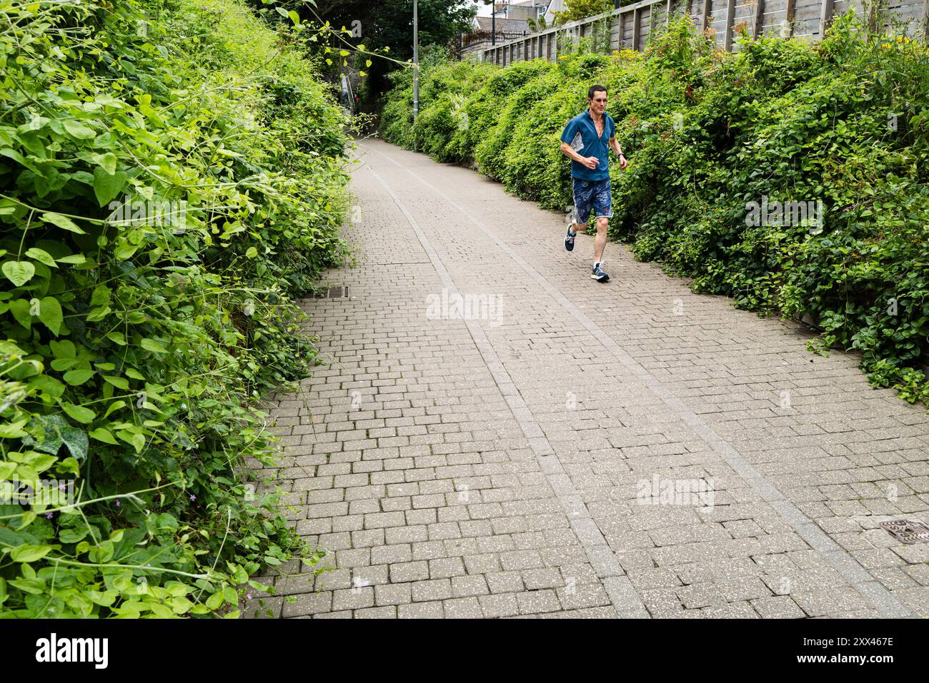 A man male running along the pedestrian walkway that was once the ...
