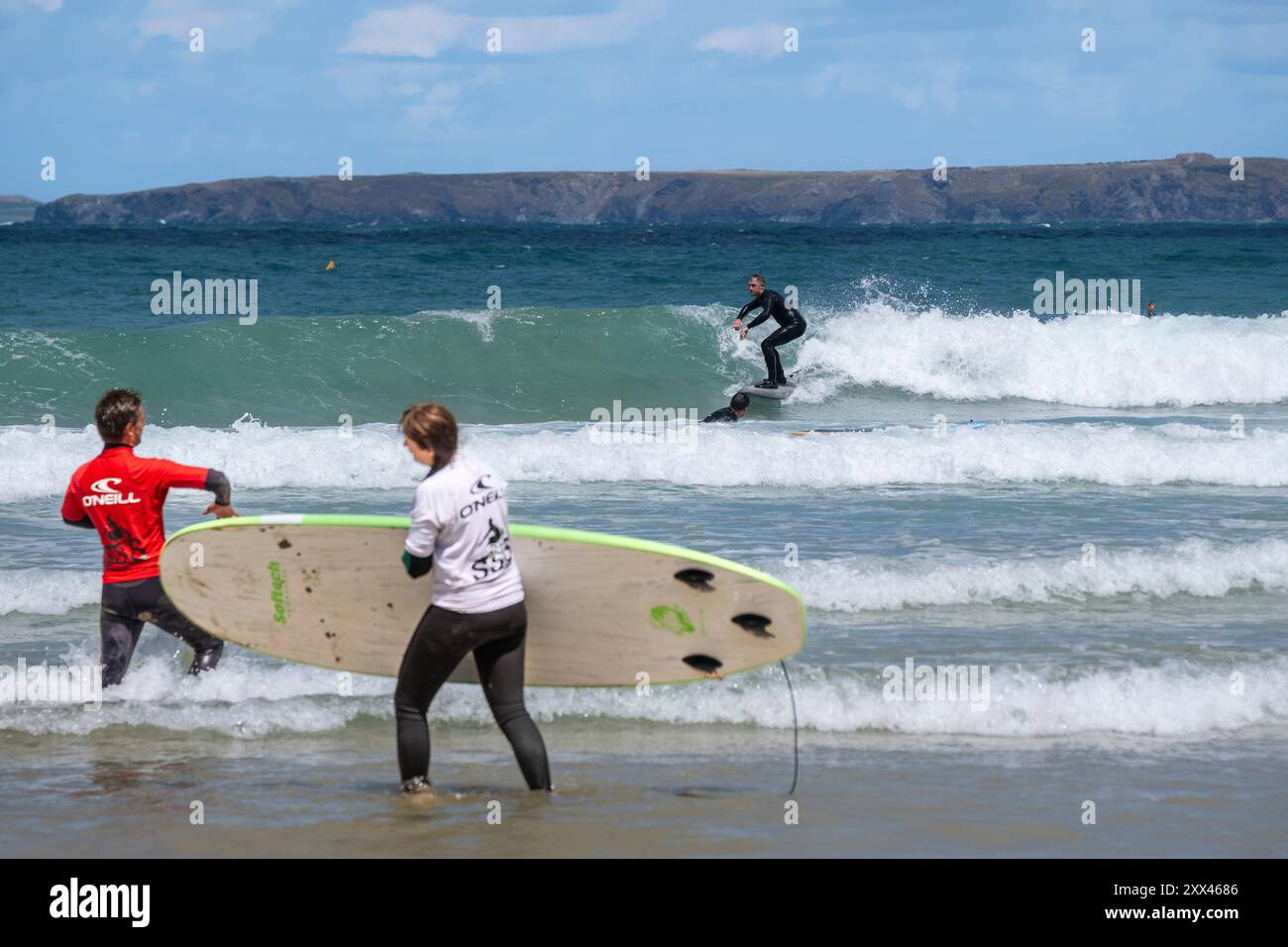 Surfing activity at Towan Beach in Newquay in Cornwall in the UK Stock ...