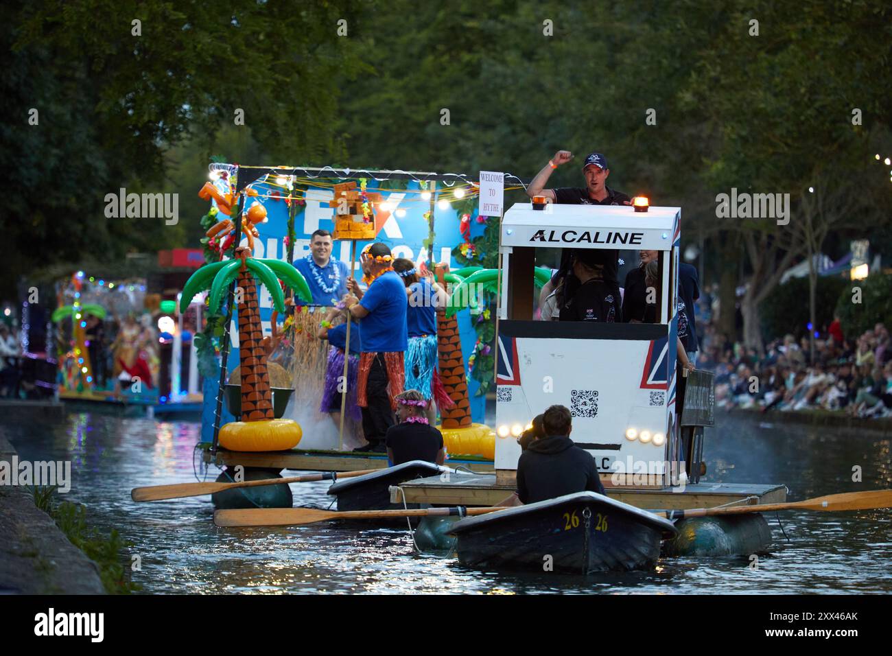 A procession of decorated boats and barges form a floating parade along ...