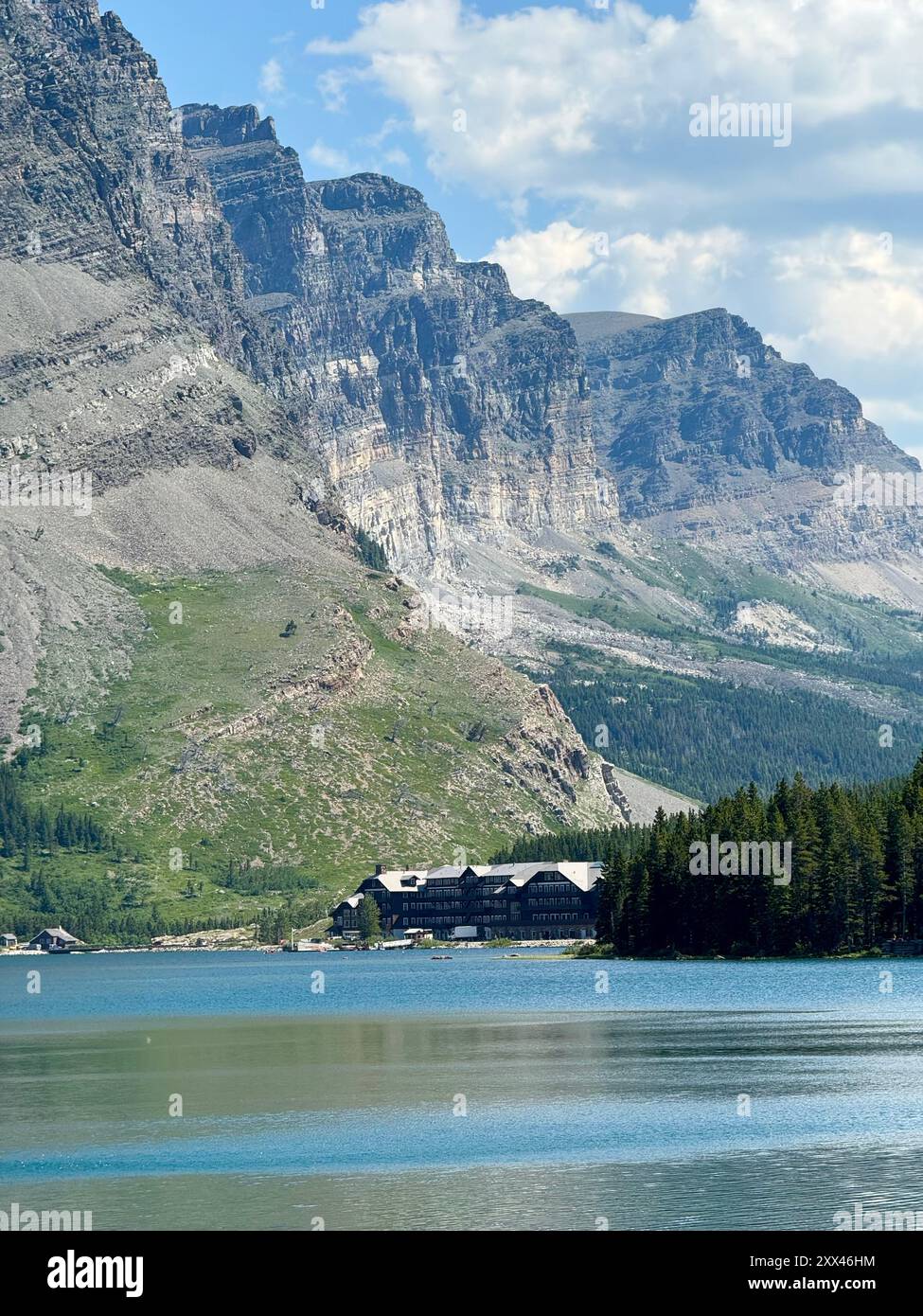 Many Glacier Hotel nestled between astounding peaks of the American ...