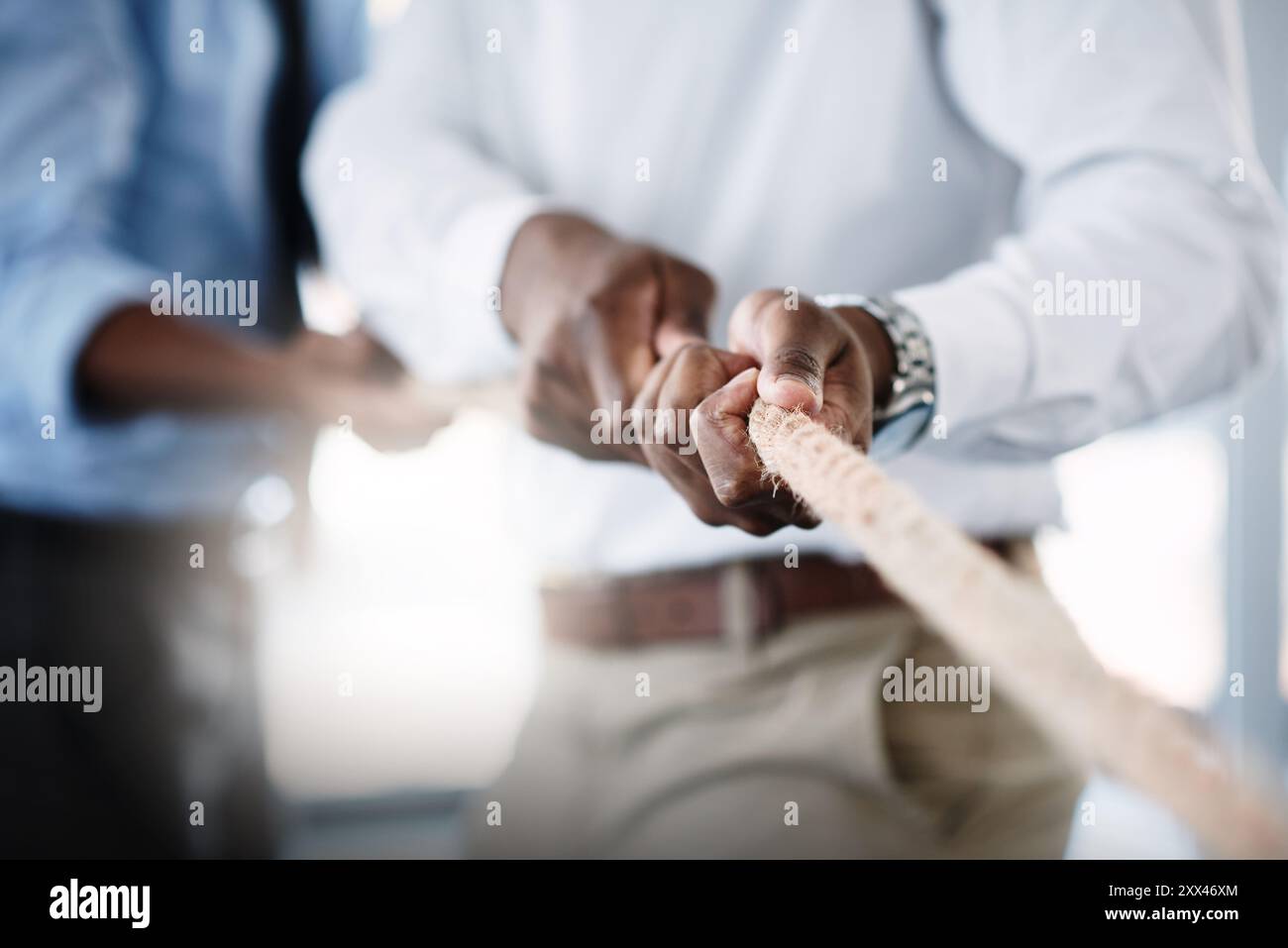 Hands, rope and tug of war with teamwork for business people, game or ...