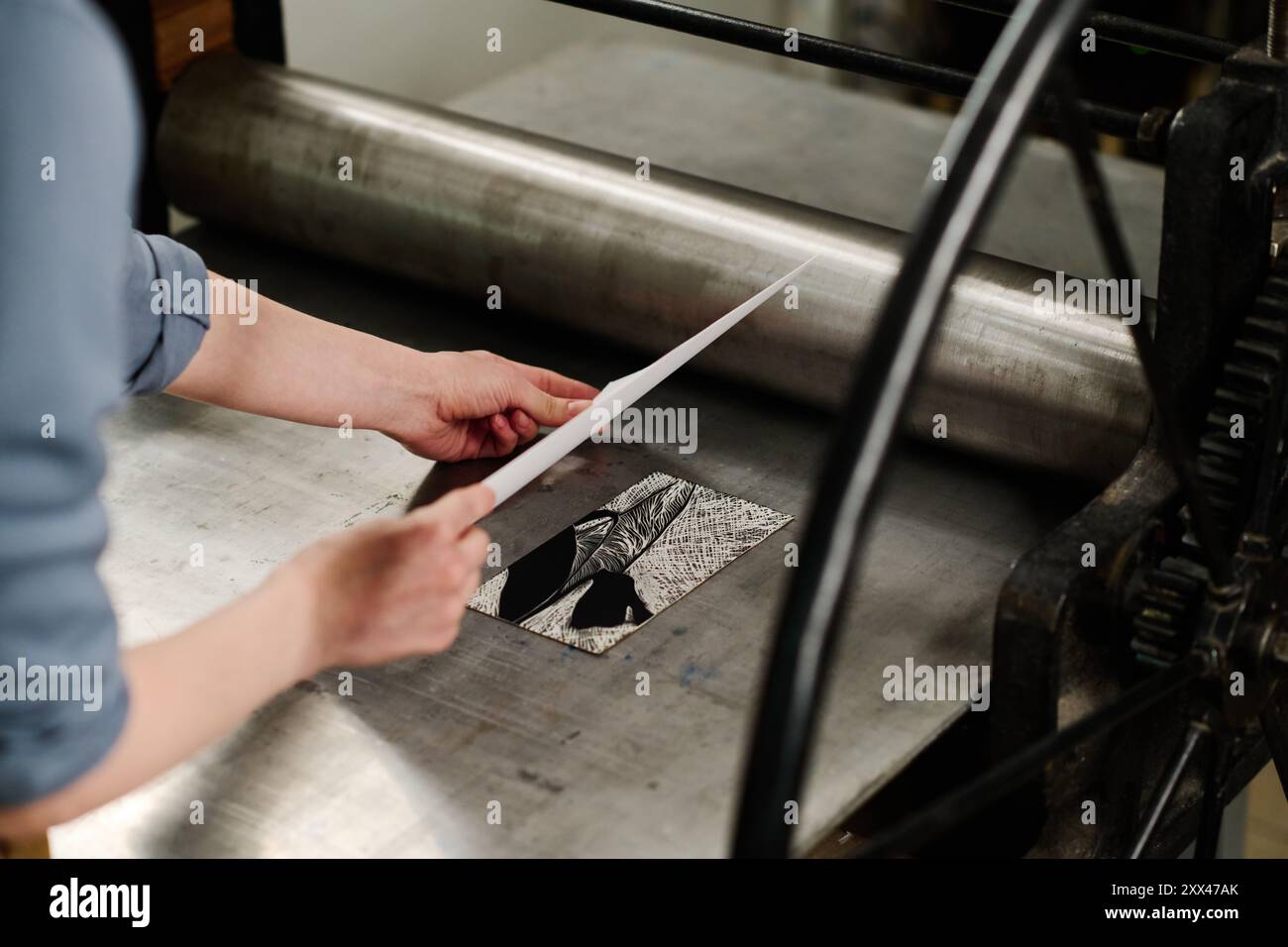 Bending over artwork hi-res stock photography and images - Alamy