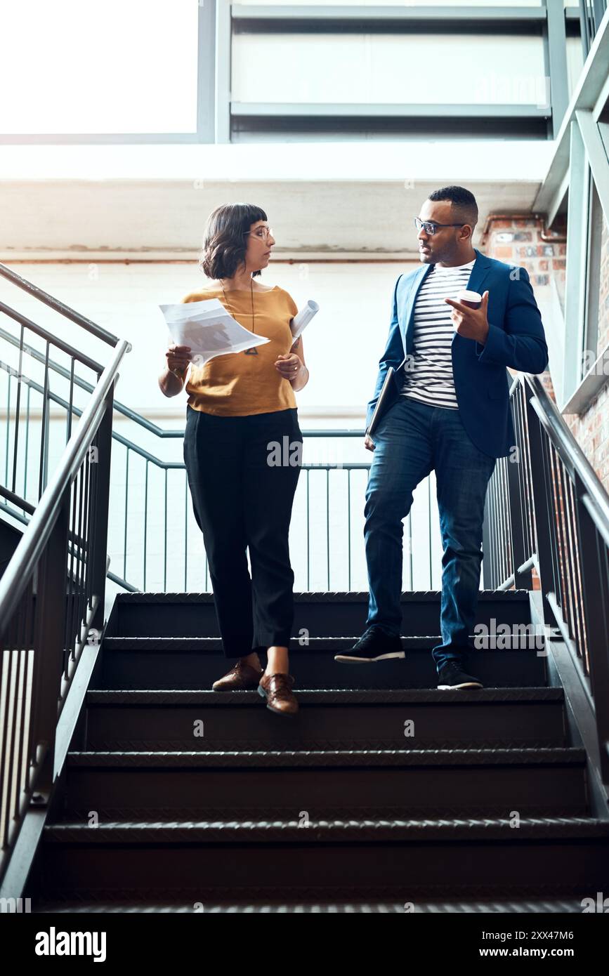 Employees, stairs and paper for teamwork talking, conversation and ...