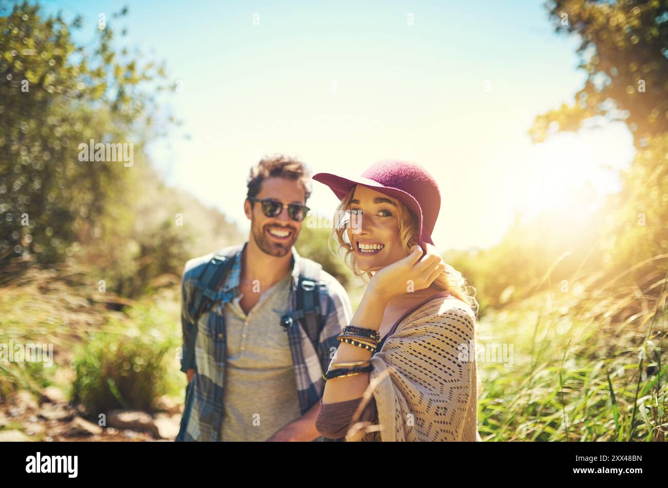 Couple, outdoor and smile on portrait in forest to explore nature ...