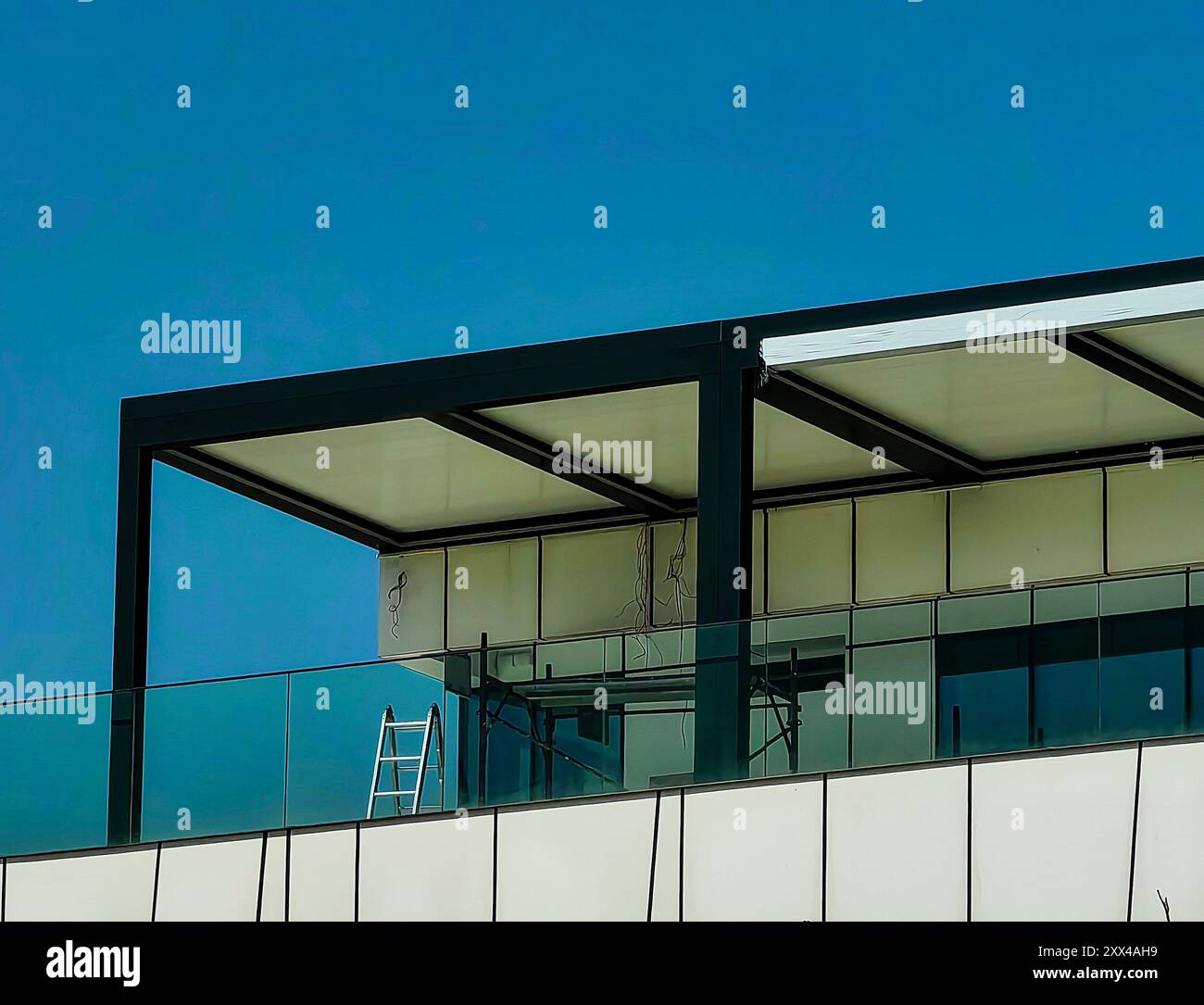 Rooftop Under Construction: White Ladders and Modern Balcony with Glass ...