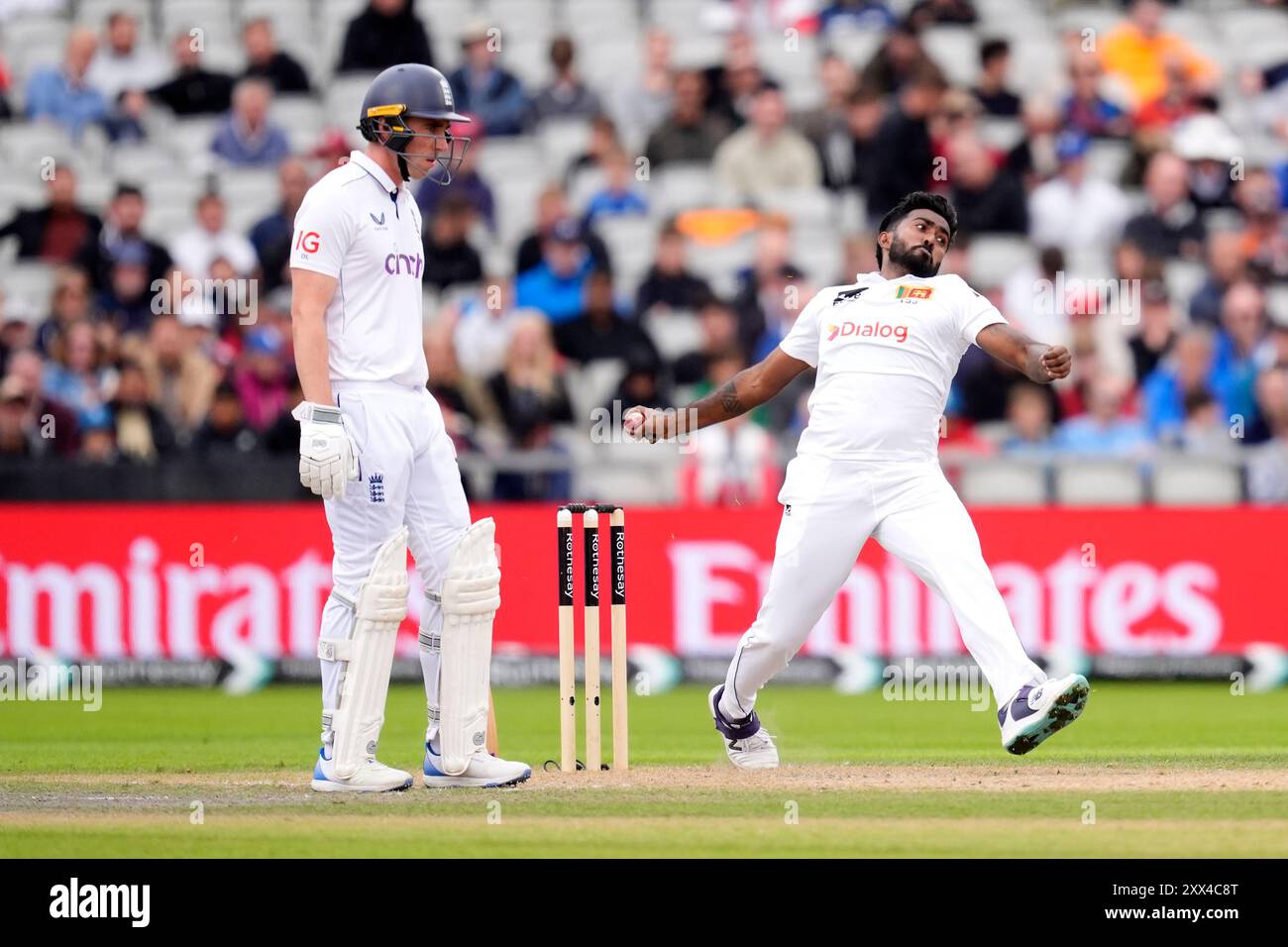 Sri Lanka's Asitha Fernando (right) bowling as England's Dan Lawrence ...