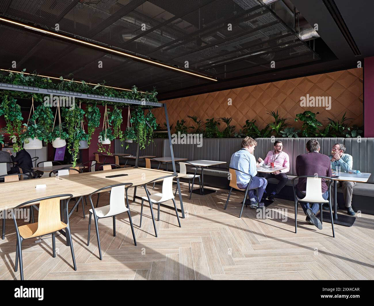 Cafe interior and staff communicating. Building 1180, Reading, United Kingdom. Architect ...