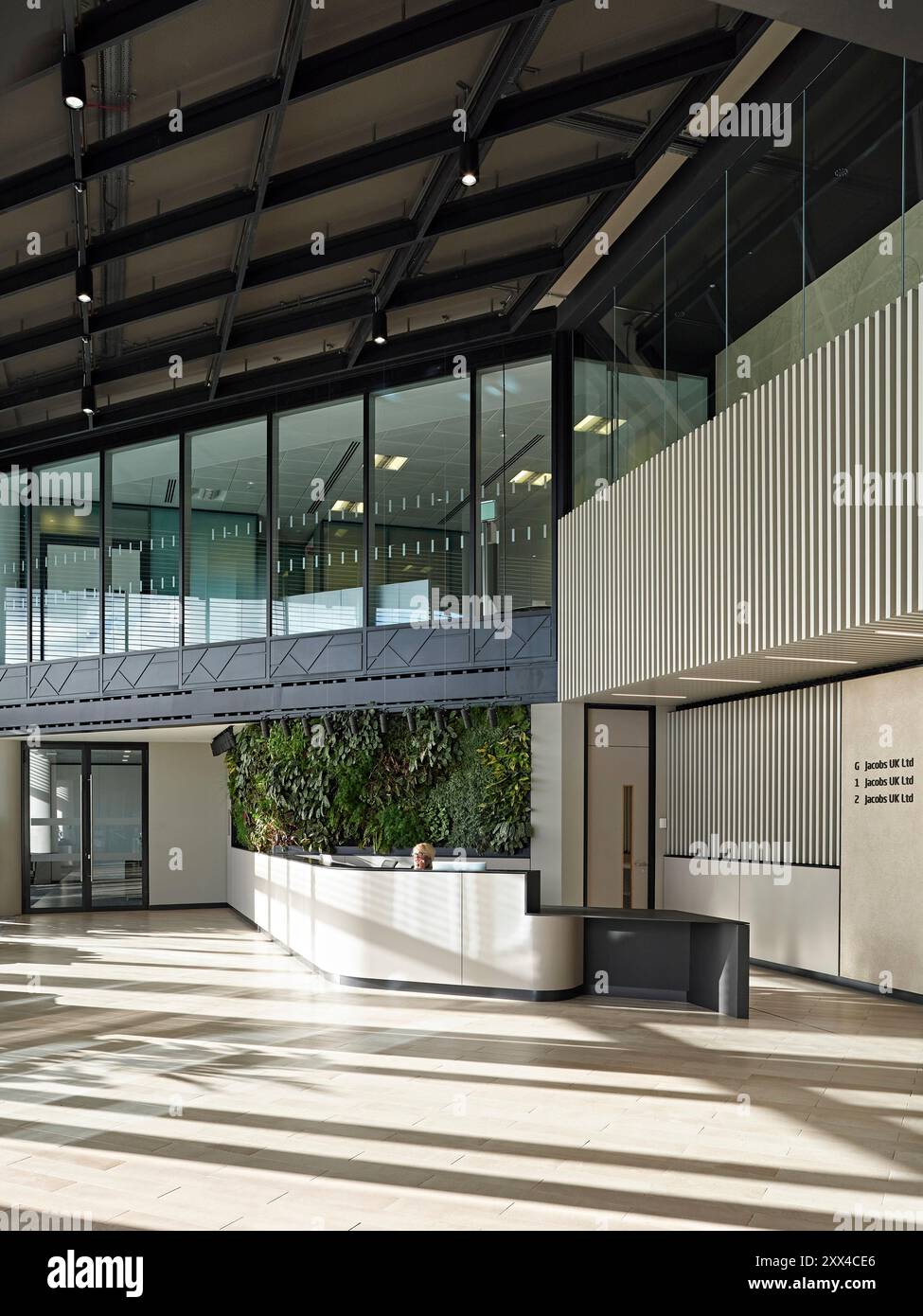 Reception and desk with green wall. Building 1180, Reading, United ...