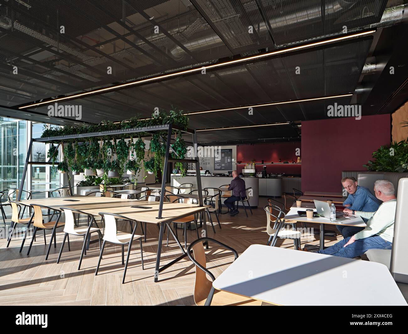 Cafe interior and staff communicating. Building 1180, Reading, United Kingdom. Architect ...