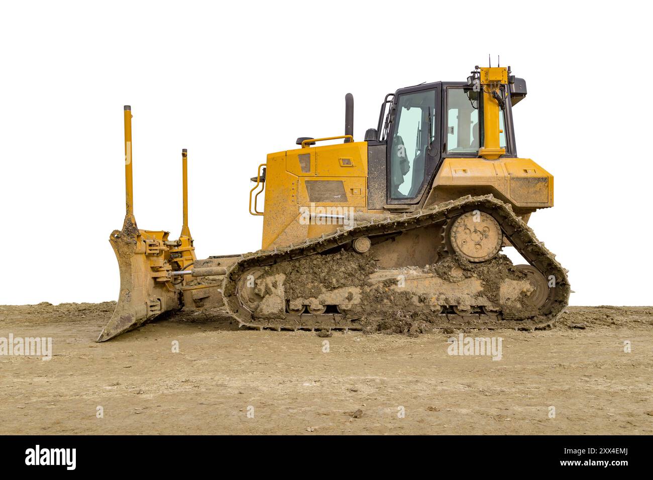 Yellow bulldozer at a loamy construction site, partly isolated in white ...