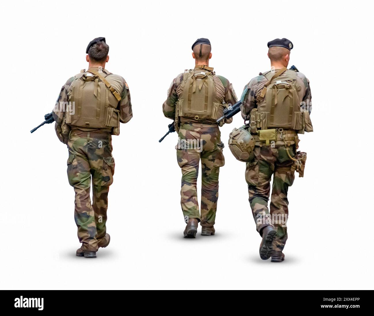 Rear view of a three person military patrol isolated in white back with ...