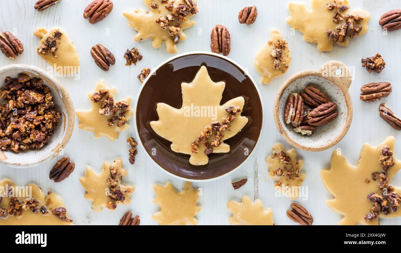Homemade maple pecan leaf shortbread cookies scattered about with ...