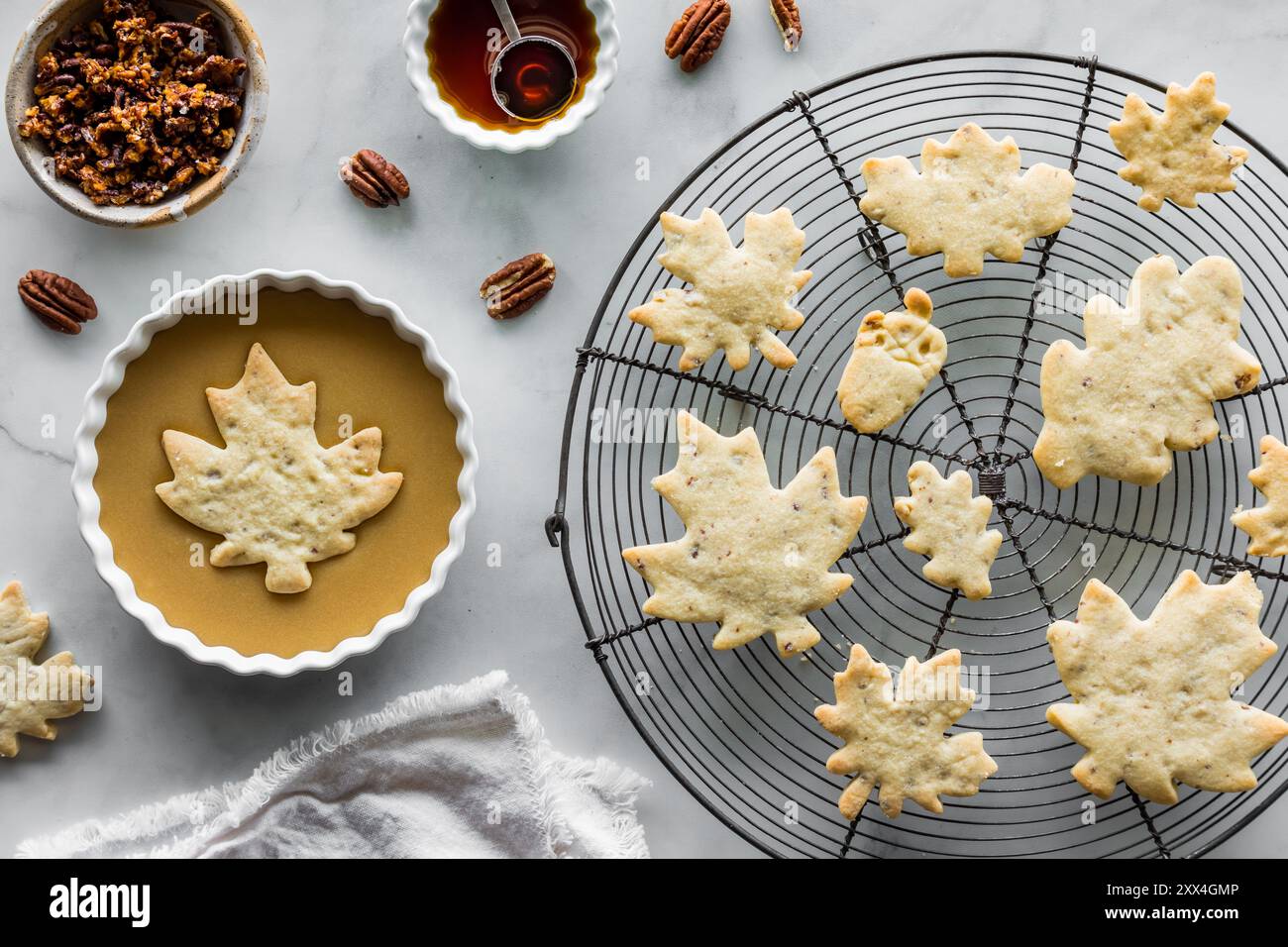 Preparing freshly baked maple pecan shortbread cookies with a maple ...